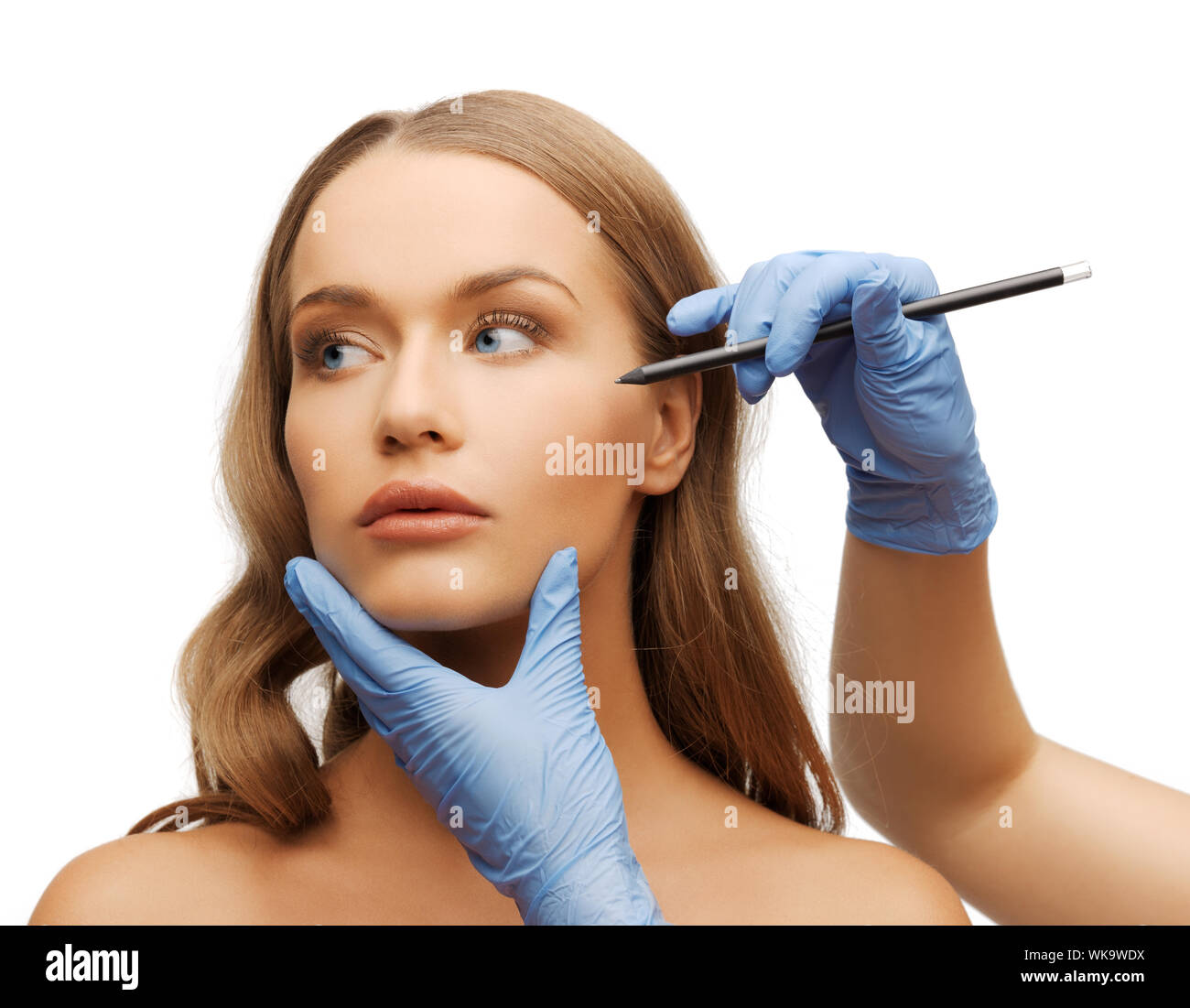 cosmetic surgery concept - woman face and beautician hands with pencil ...