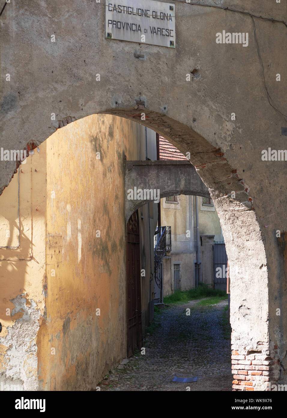 Castiglione Olona - italy, arched cobblestone alleys in a well ...