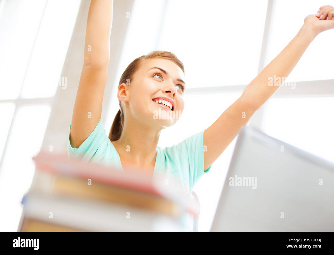 happy student girl with computer at school Stock Photo - Alamy