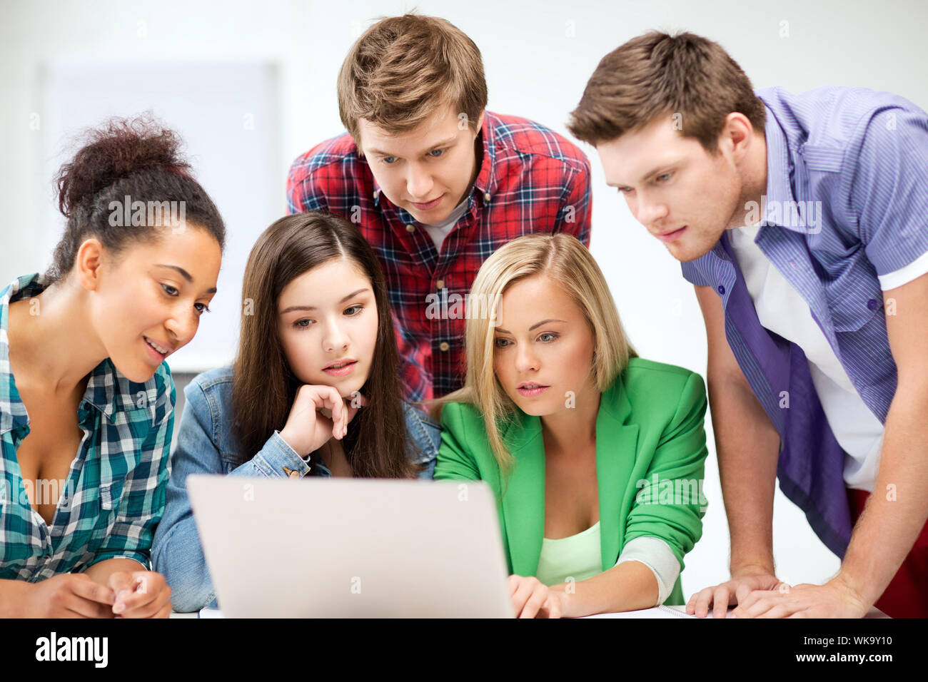 international students looking at laptop at school Stock Photo - Alamy