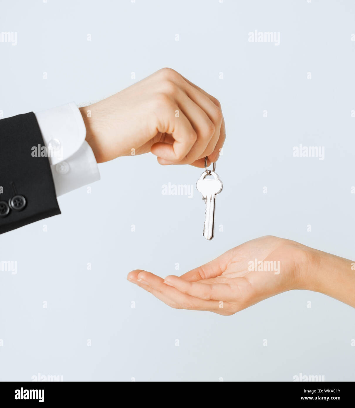 picture of man hand passing house keys to woman Stock Photo - Alamy