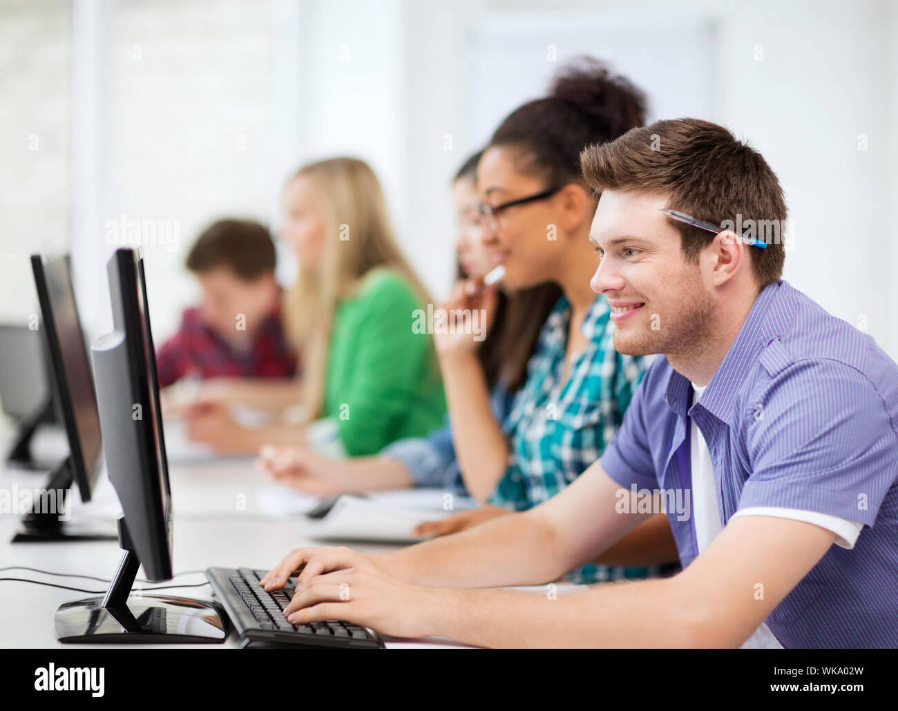students with computers studying at school Stock Photo - Alamy