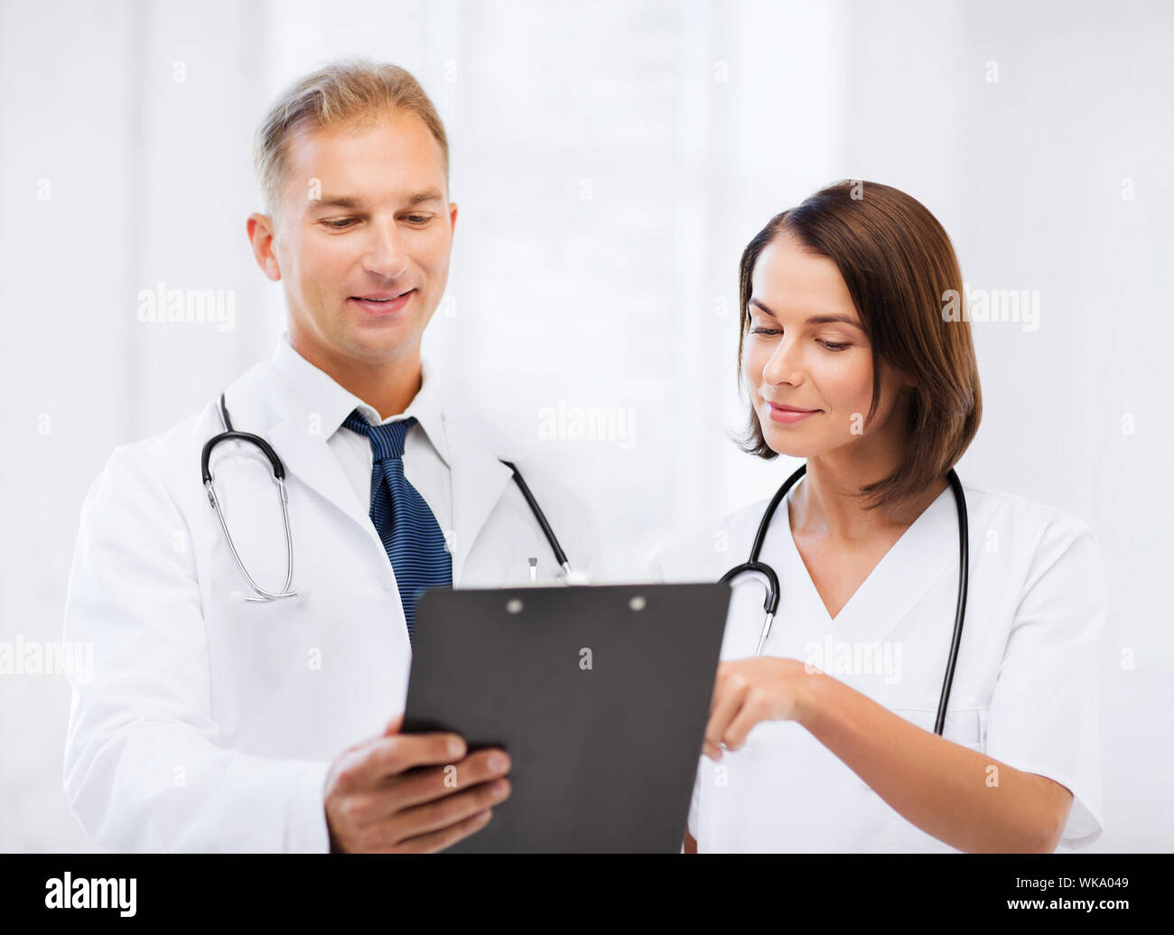 healthcare and medical concept - two doctors discussing diagnosis Stock ...