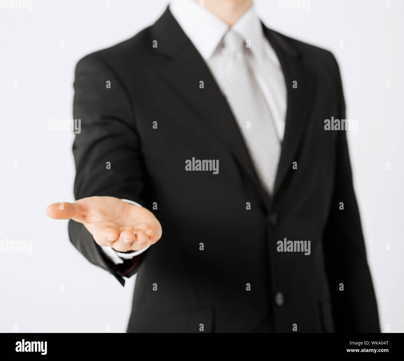 close up of mans hand showing something Stock Photo - Alamy