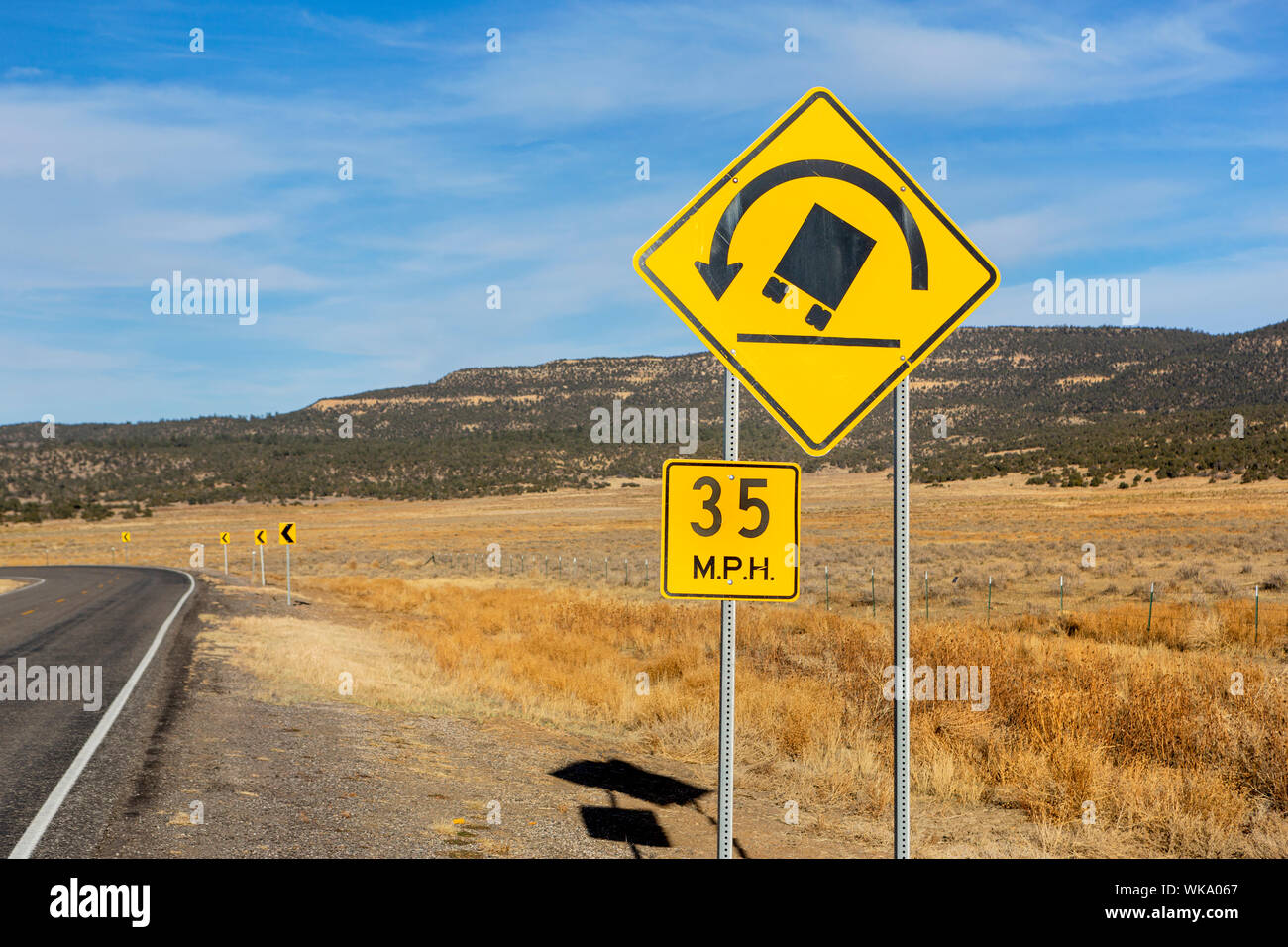 A dangerous corner sign Stock Photo - Alamy