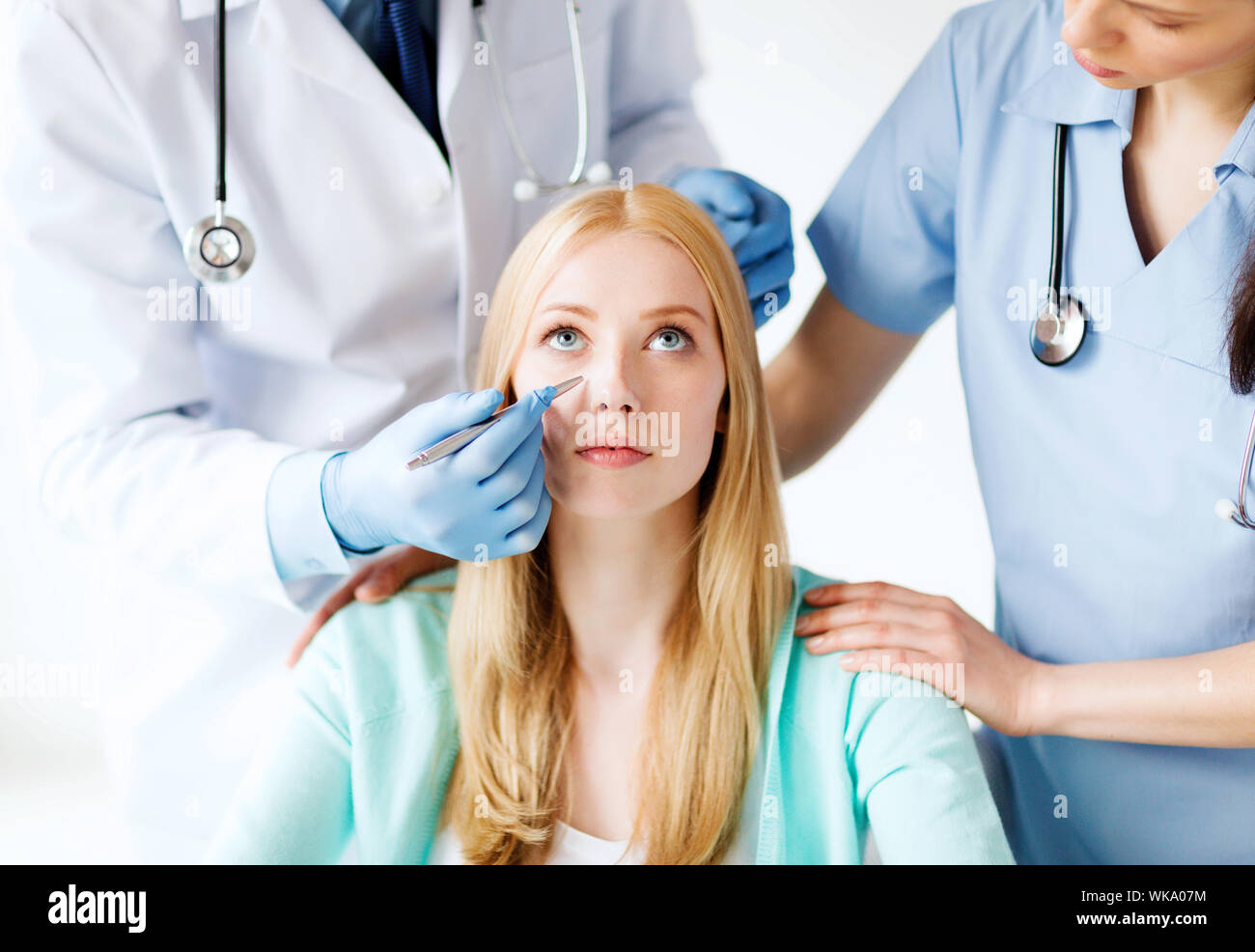 healthcare, medical and plastic surgery concept - plastic surgeon and ...