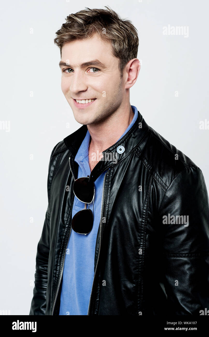 Smart young man with a black leather jacket Stock Photo - Alamy
