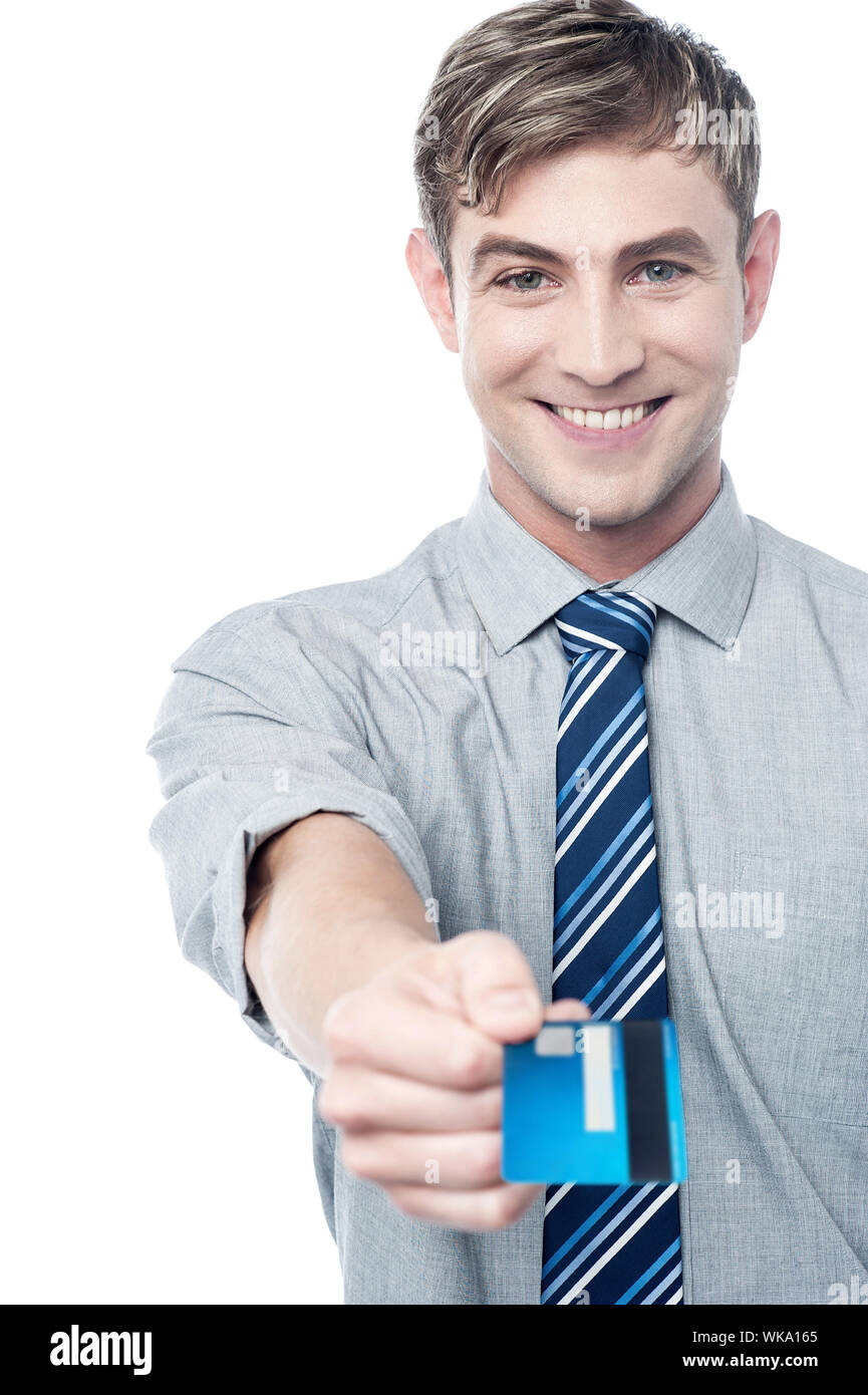 Young corporate guy showing his debit card Stock Photo - Alamy