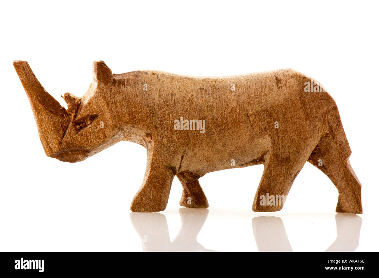 wooden Rhinoceros in miniature isolated over white Stock Photo - Alamy