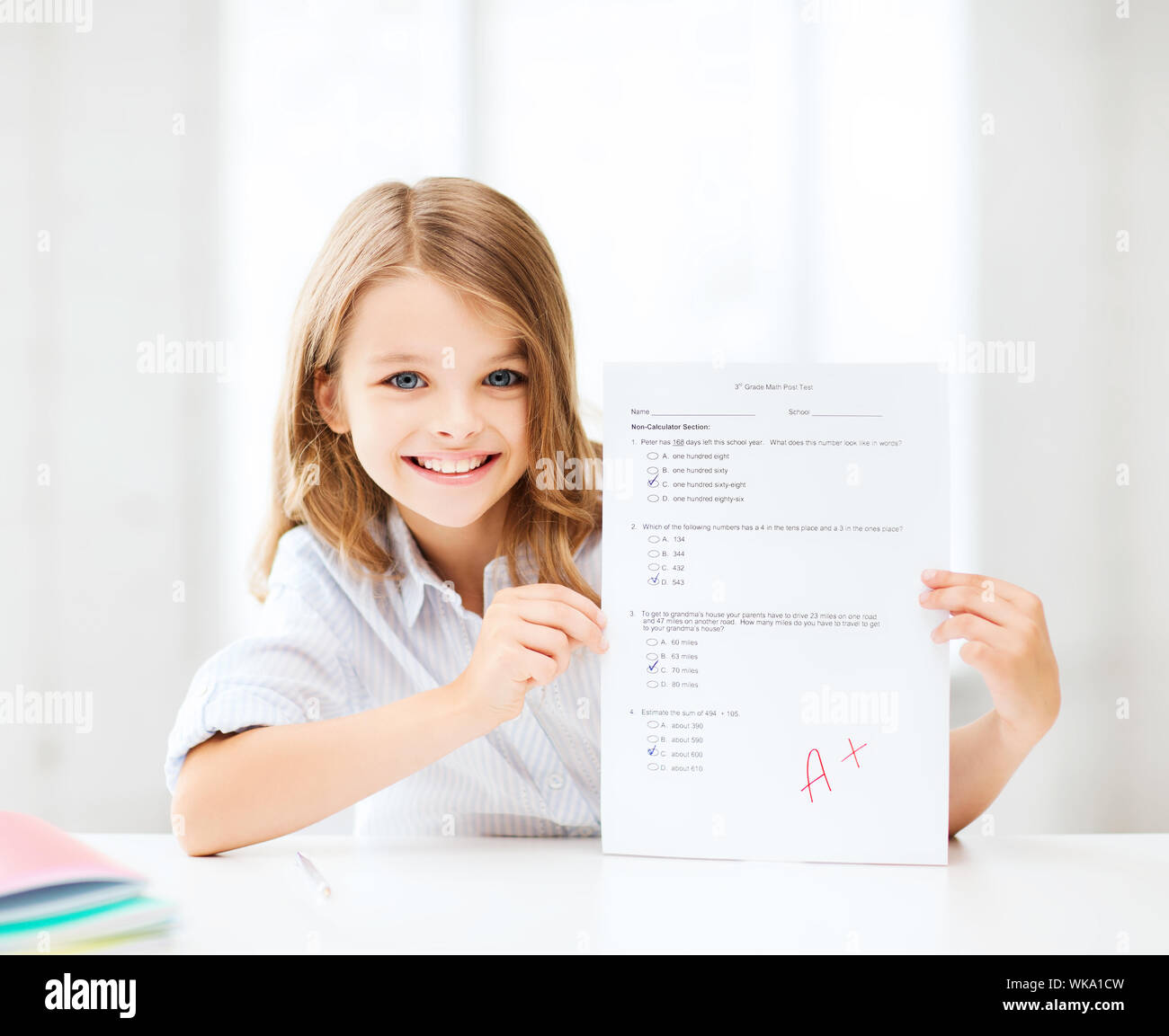 girl with test and A grade at school Stock Photo - Alamy