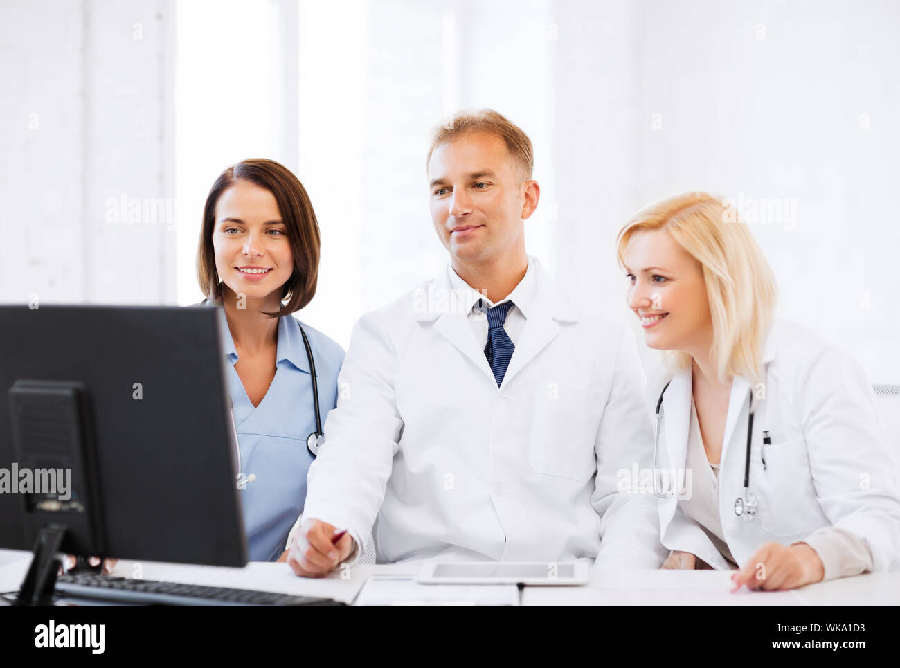 doctors looking at computer on meeting Stock Photo - Alamy