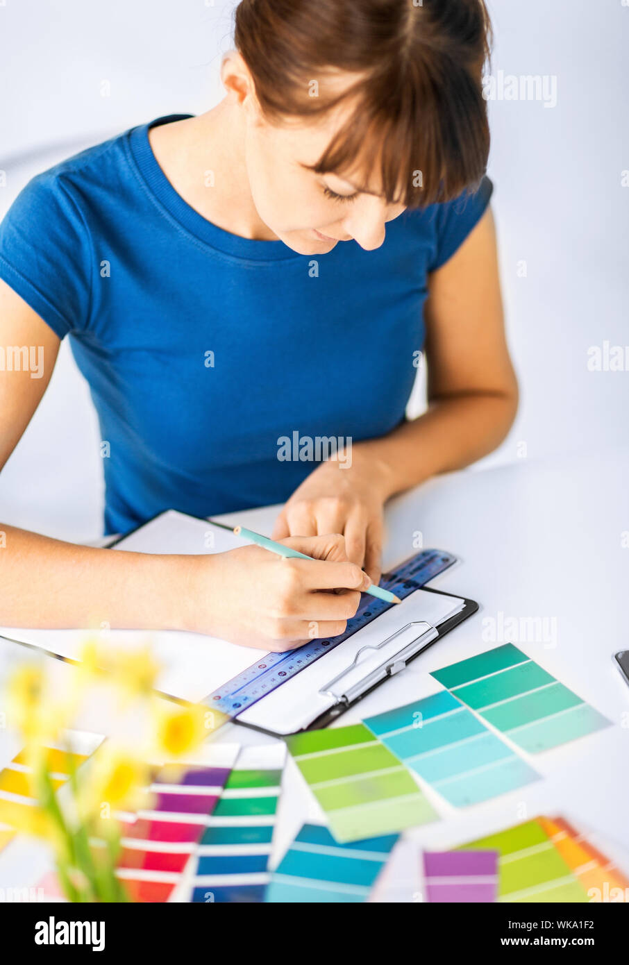 interior design and renovation concept - woman working with color ...