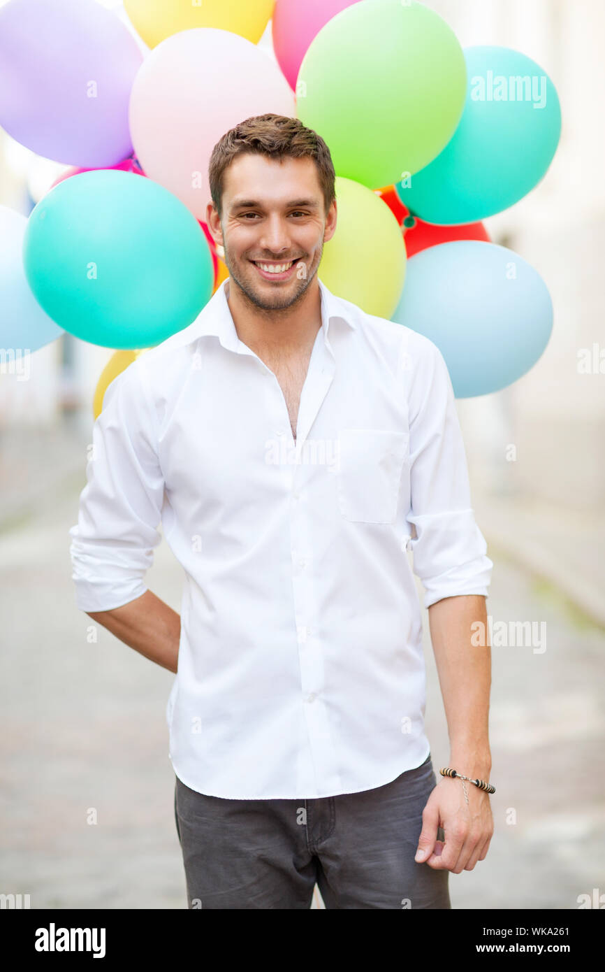 Man flying helium balloons hi-res stock photography and images - Alamy