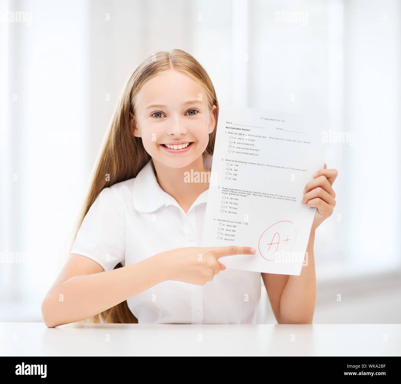 girl with test and grade at school Stock Photo - Alamy