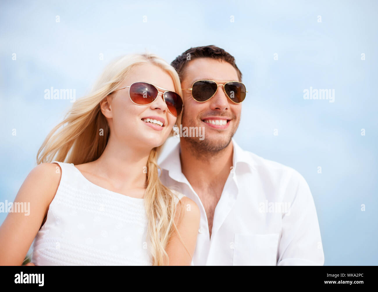 summer holidays and dating concept - couple in shades at sea side Stock ...