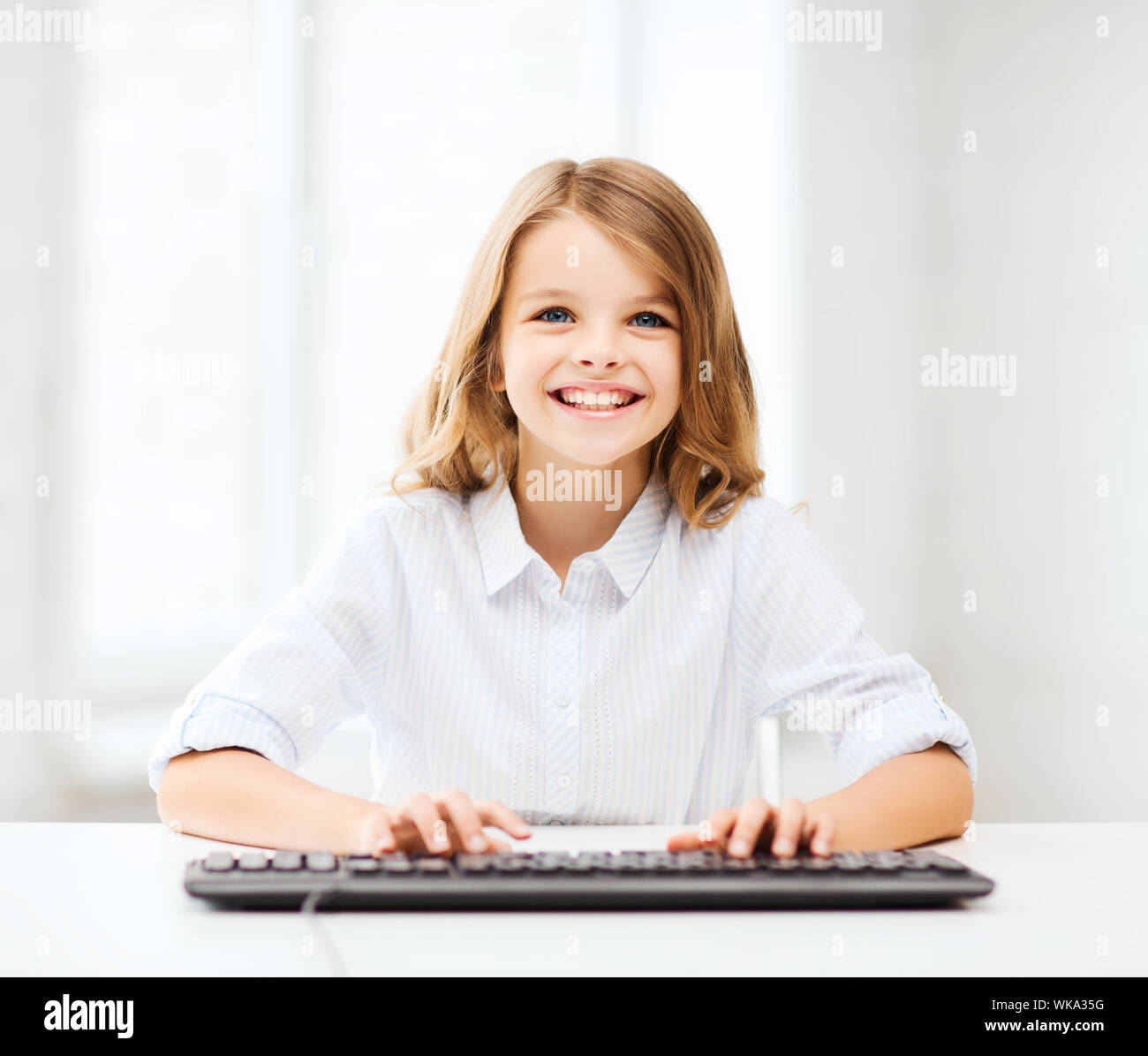 student girl with keyboard Stock Photo - Alamy