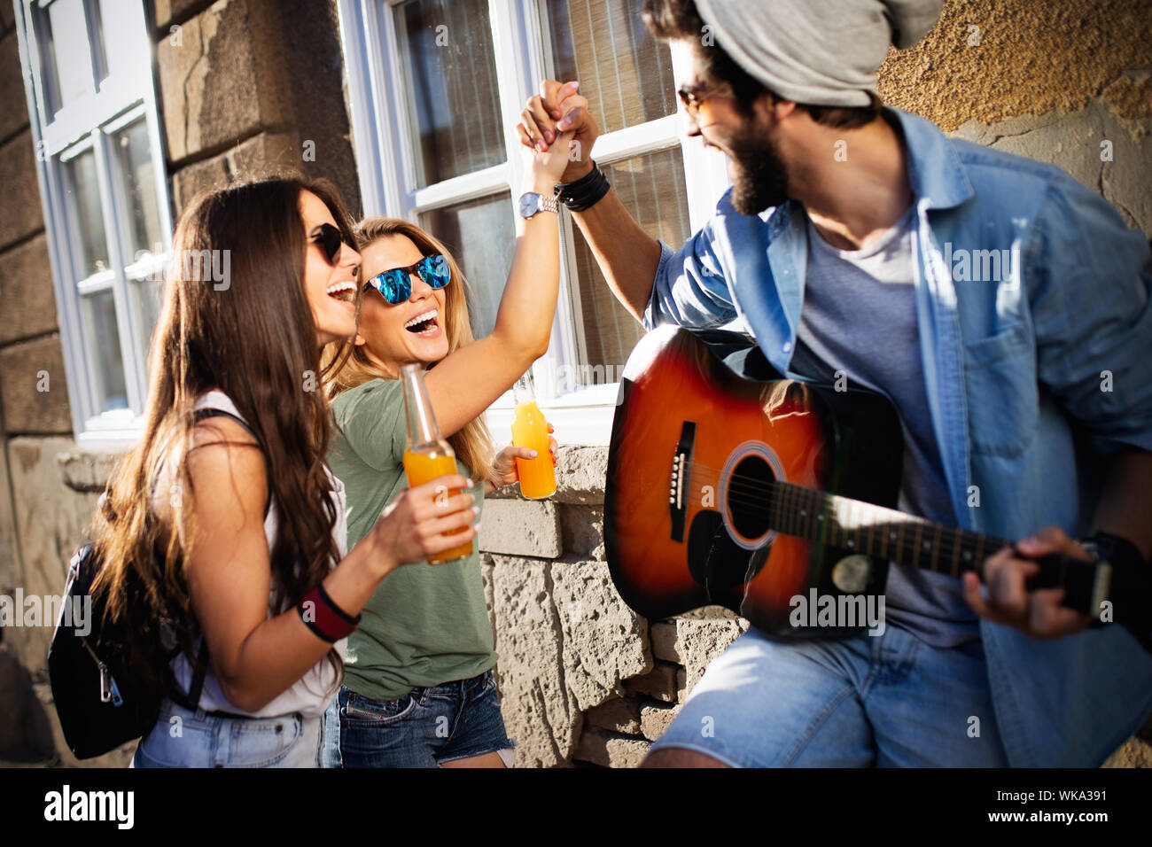 Group of friends hanging out, having fun and enjoying summer days Stock ...