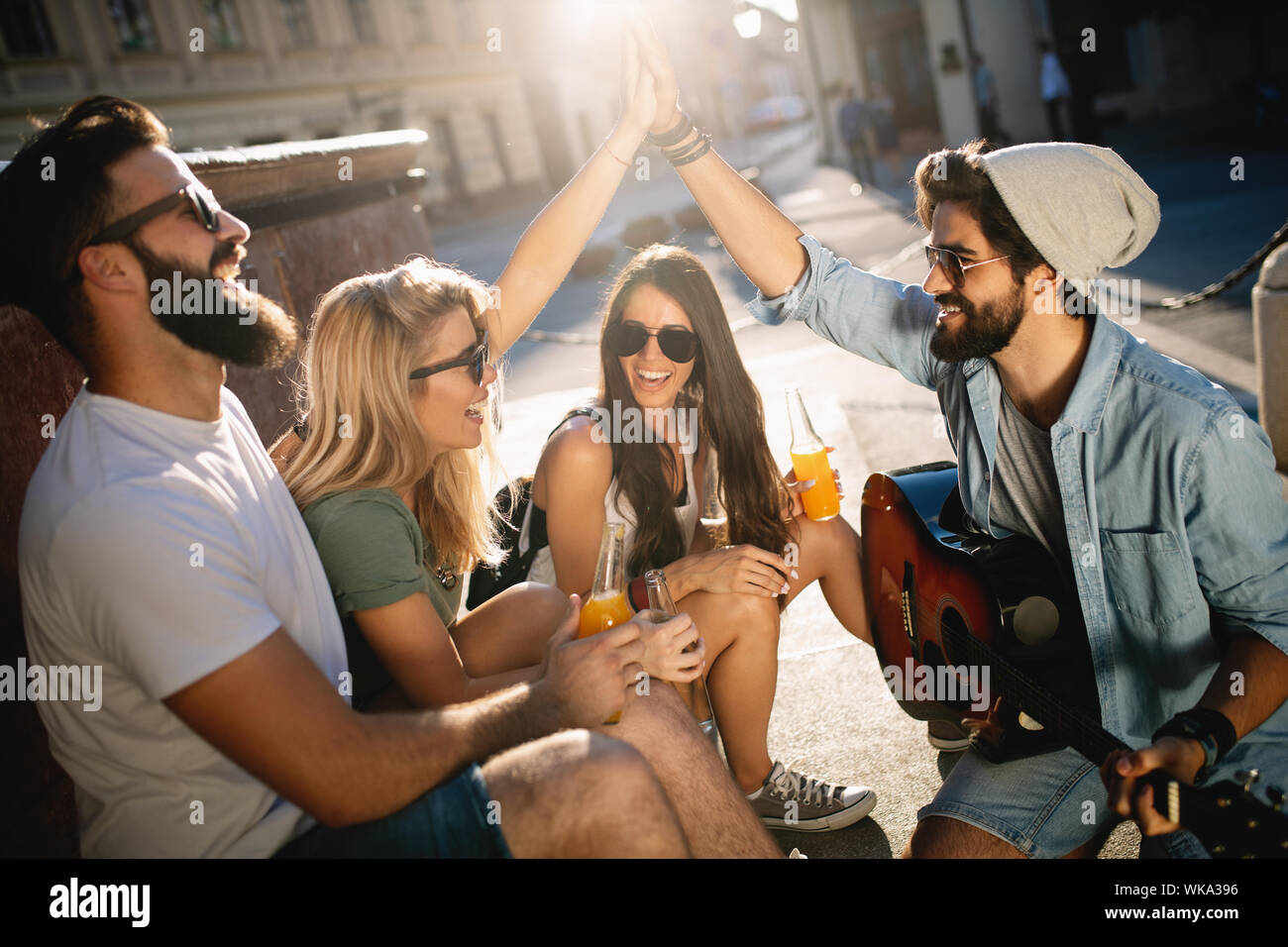 Happy young people having fun spending good time together Stock Photo ...