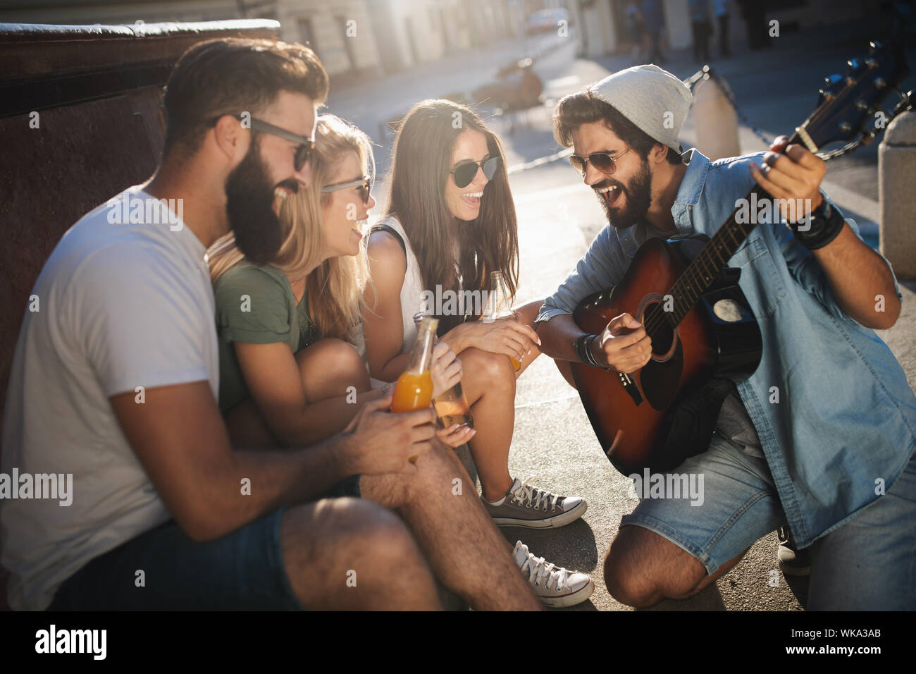 Happy young people having fun spending good time together Stock Photo ...
