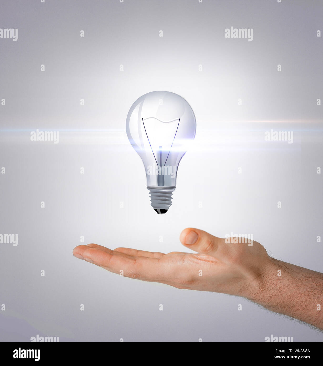 man hand with light bulb Stock Photo - Alamy