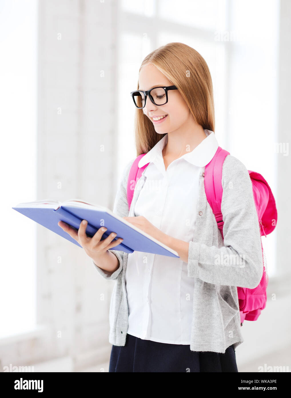 girl reading book at school Stock Photo - Alamy