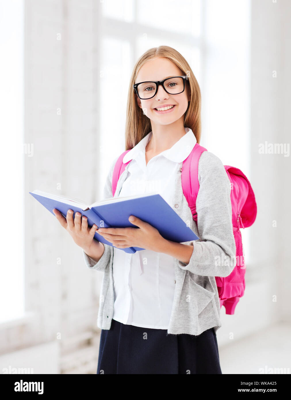 girl reading book at school Stock Photo - Alamy