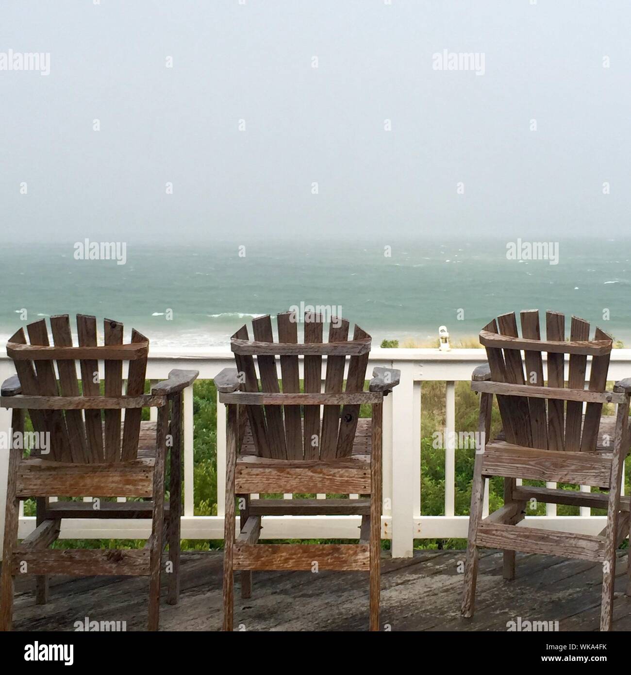Chairs railing hi-res stock photography and images - Alamy