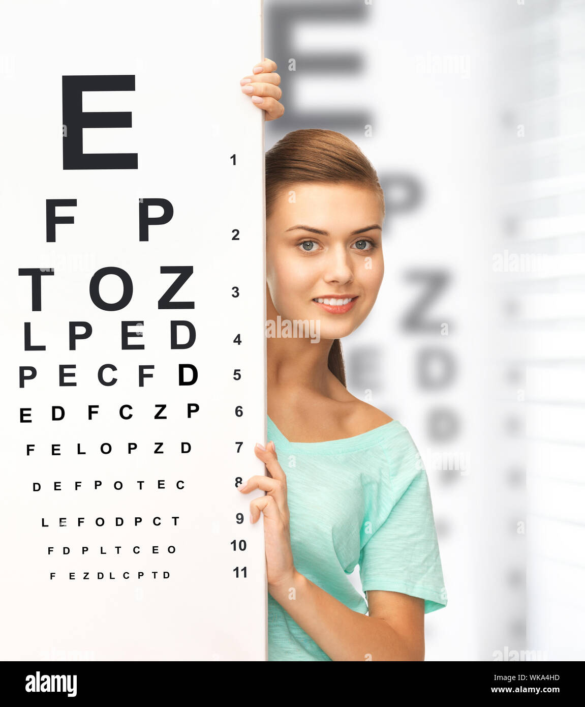 woman in eyeglasses with eye chart Stock Photo - Alamy