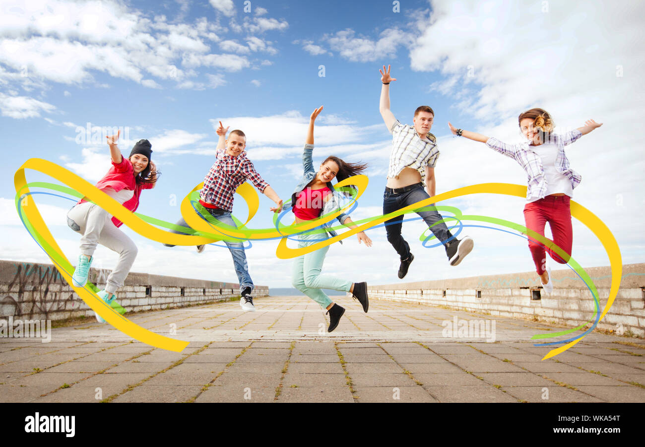group of teenagers jumping Stock Photo - Alamy
