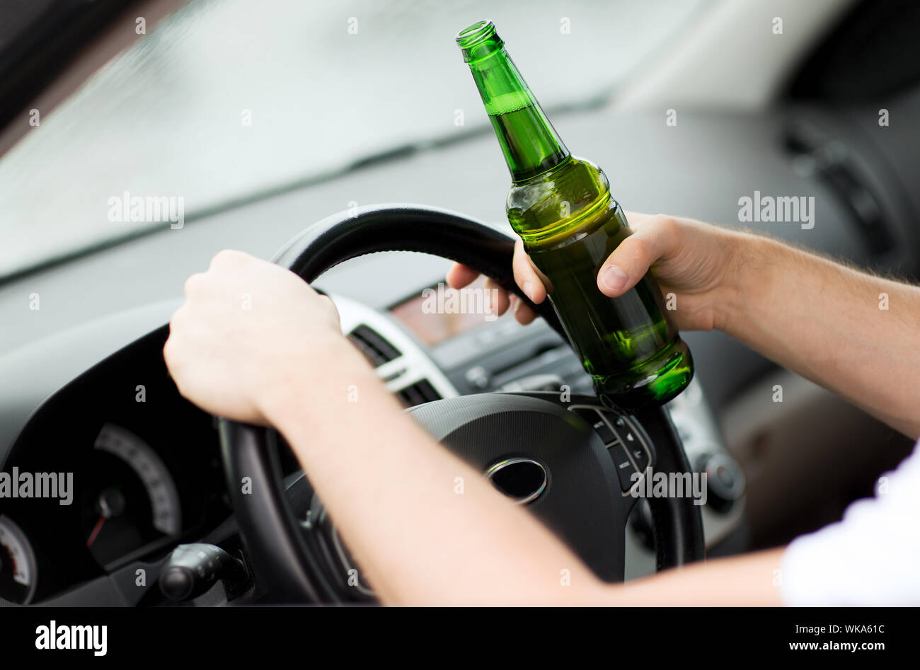 man drinking alcohol while driving the car Stock Photo - Alamy