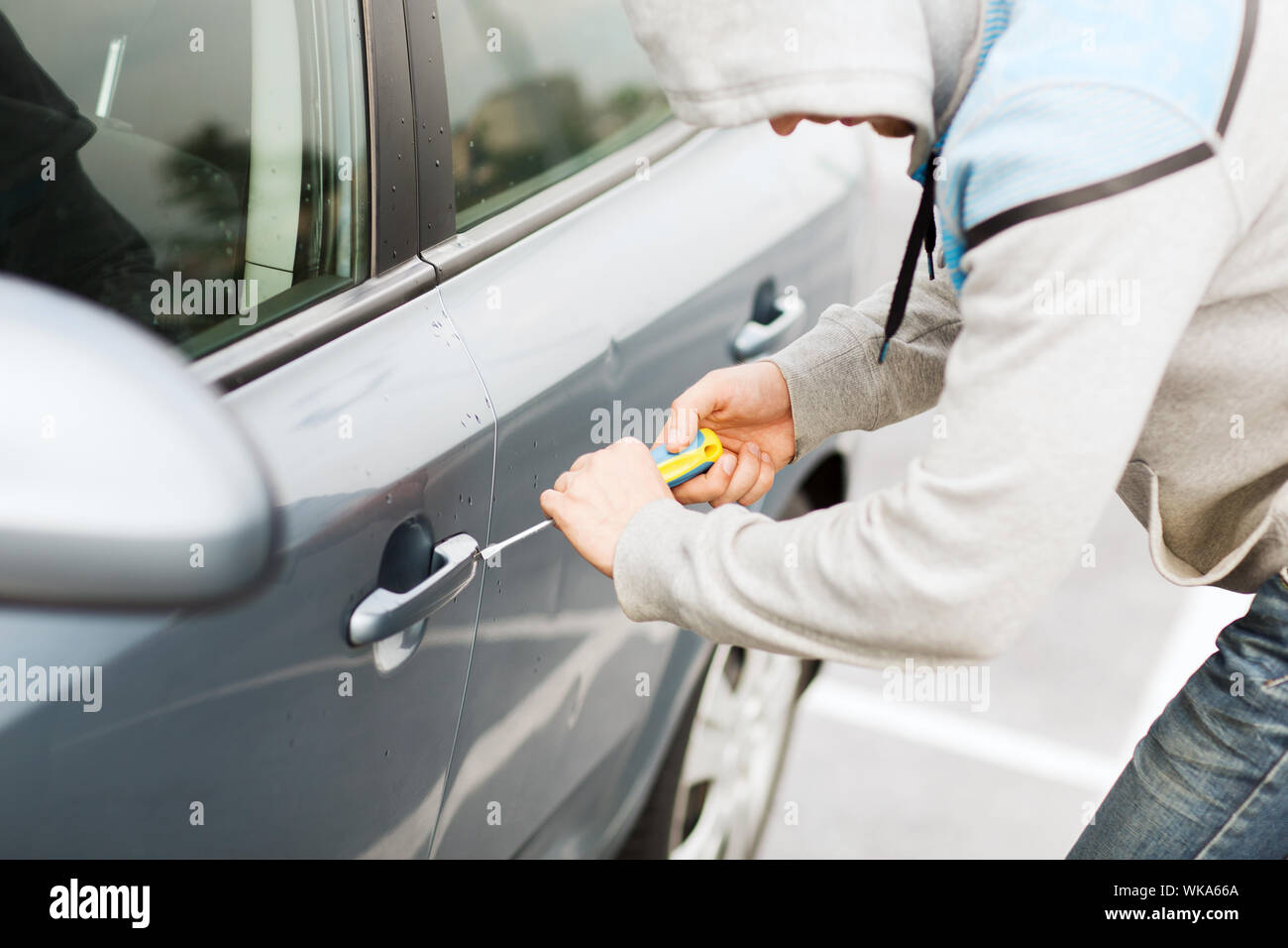 thief breaking the car lock Stock Photo - Alamy