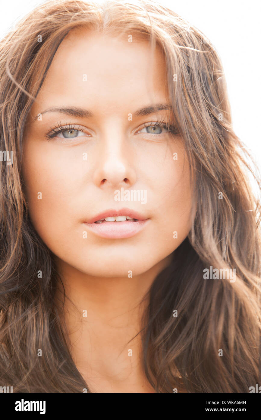 health and beauty concept - face of beautiful woman with long hair ...