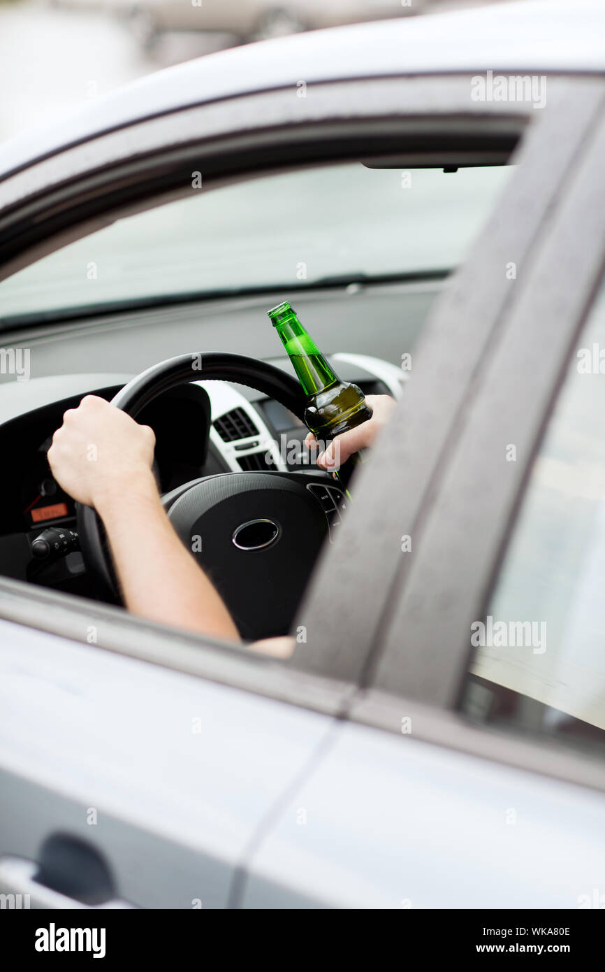 man drinking alcohol while driving the car Stock Photo - Alamy