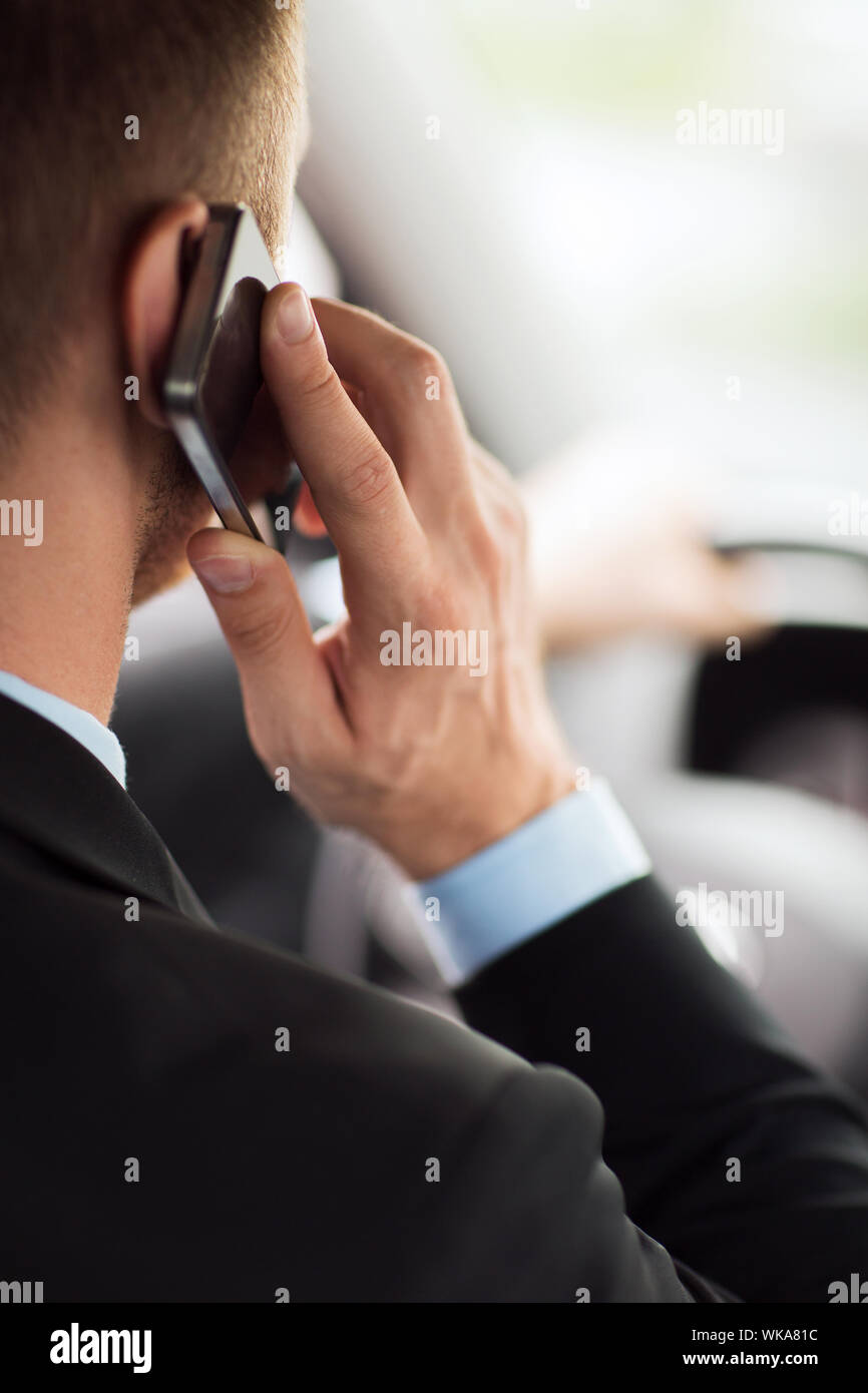 man using phone while driving the car Stock Photo - Alamy