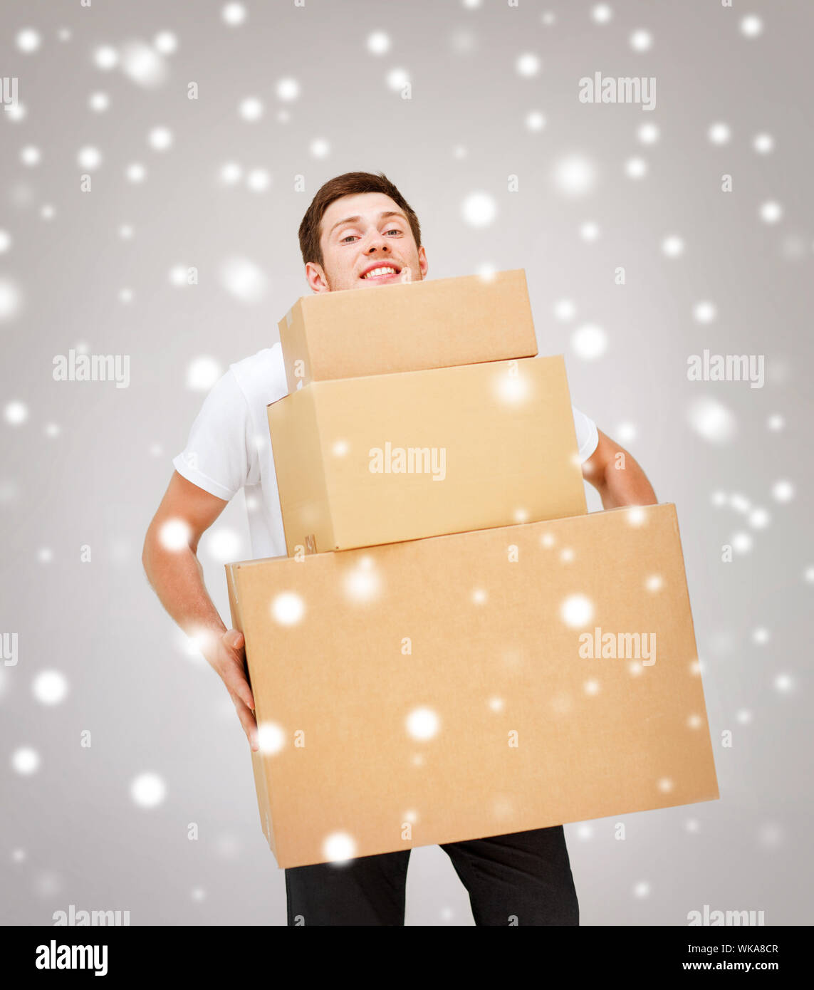 young man carrying carton boxes Stock Photo - Alamy