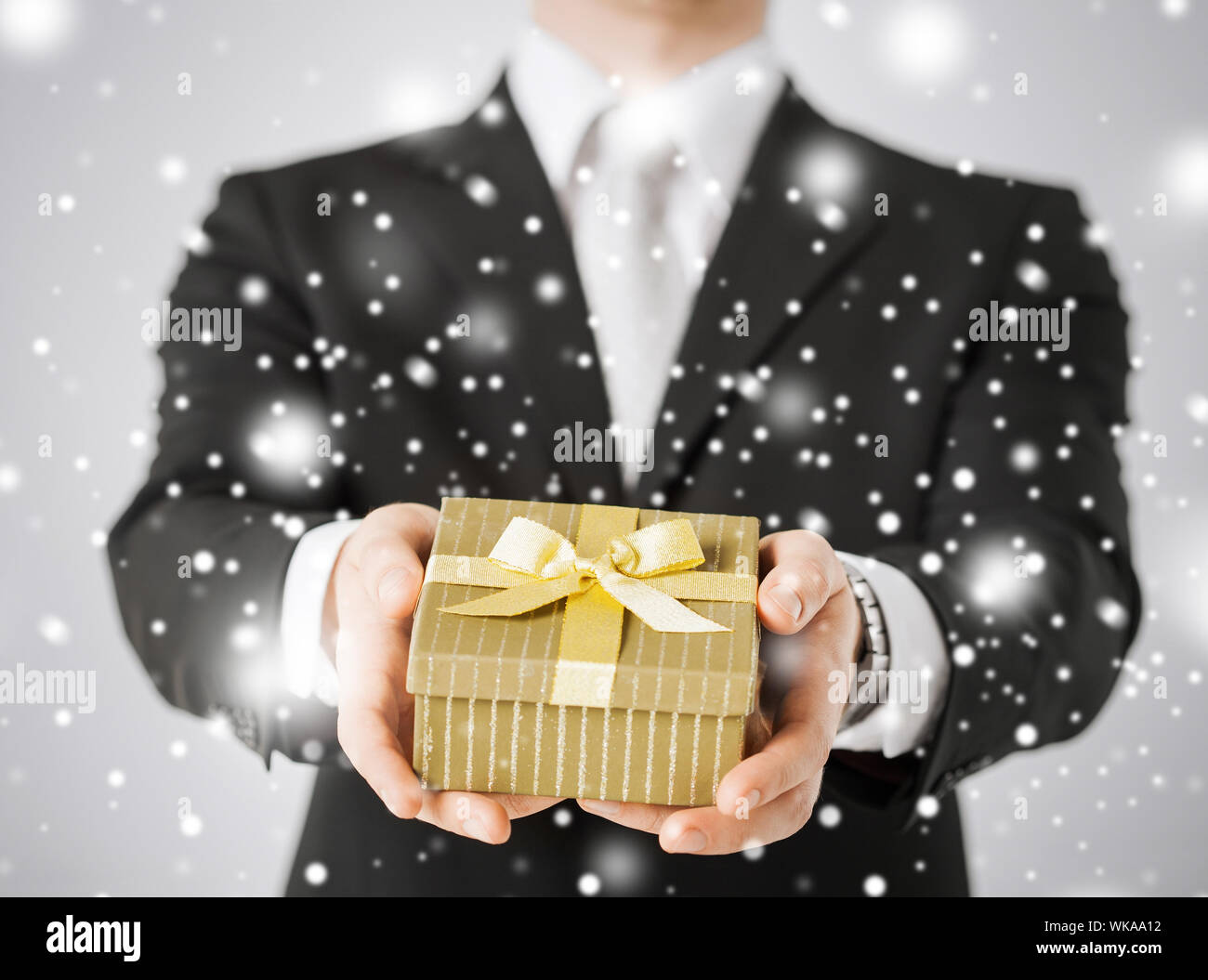 man giving gift box Stock Photo - Alamy