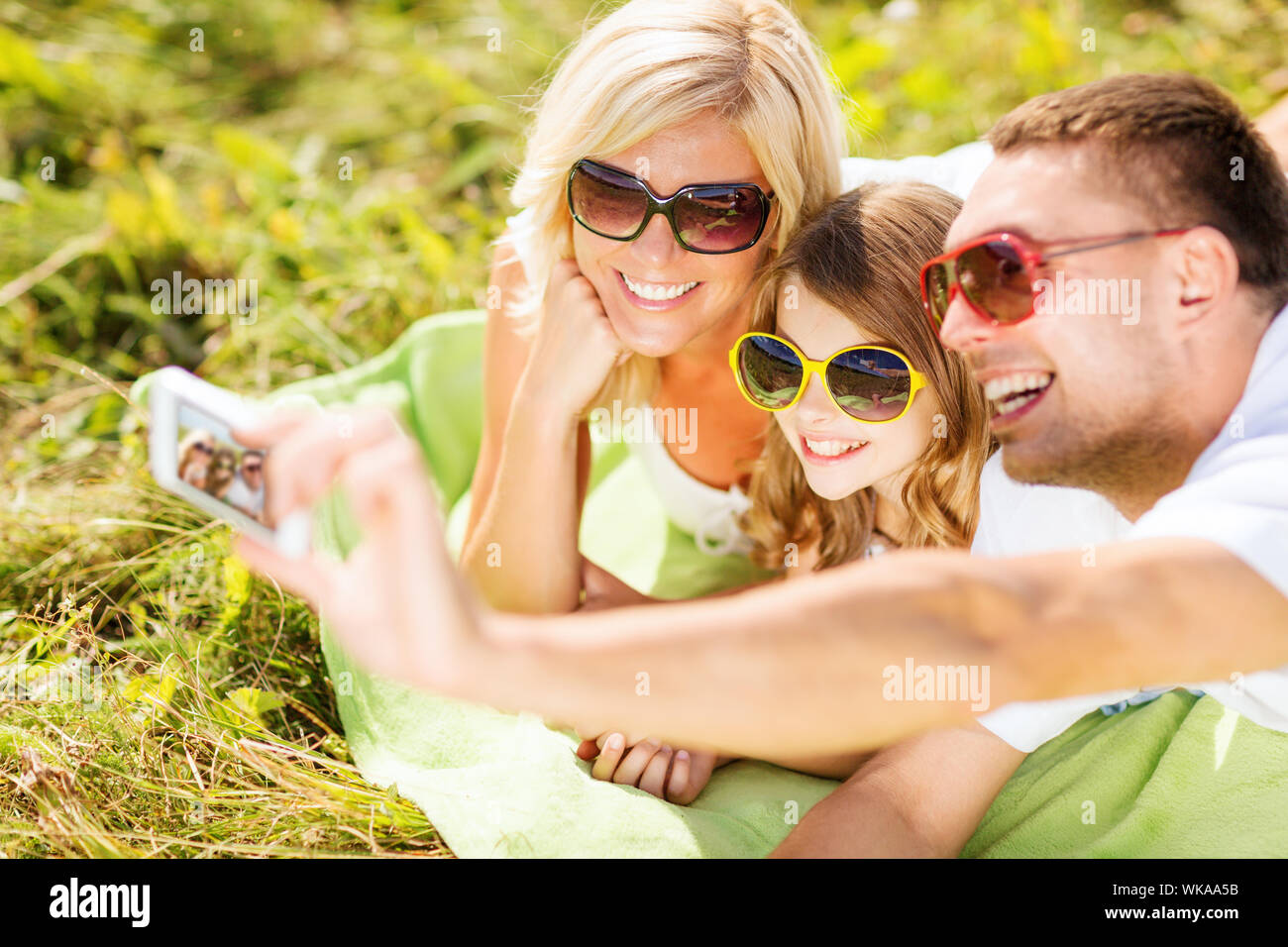 happy family with camera taking picture Stock Photo - Alamy