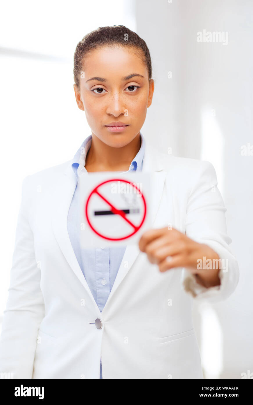 african woman with restriction no smoking sign Stock Photo - Alamy