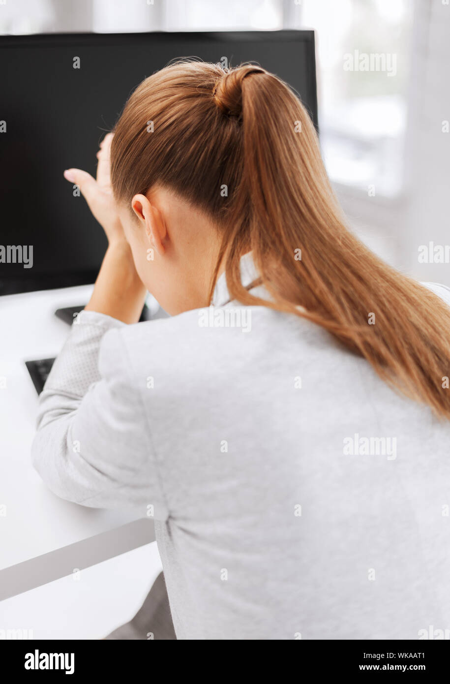 stressed woman with computer Stock Photo - Alamy
