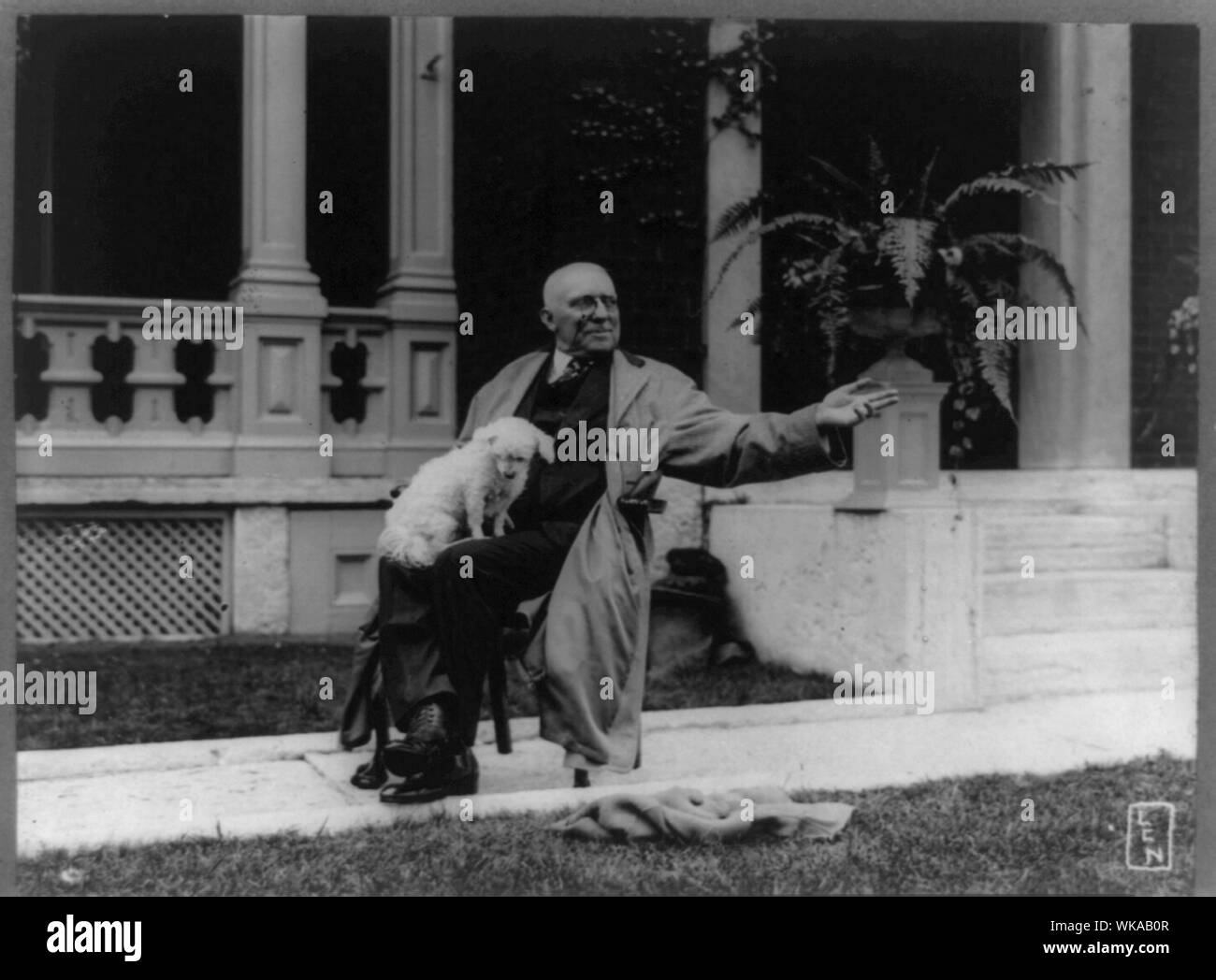 James Whitcomb Riley, full-length portrait, seated, facing right, with ...