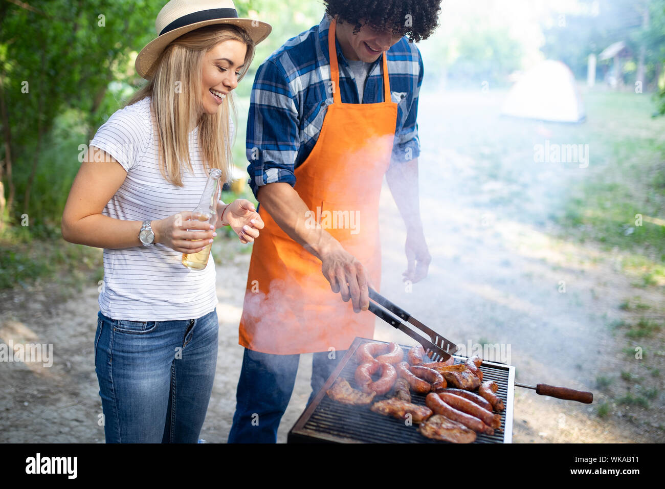 Couple outdoor grilling meat park barbecue hi-res stock photography and ...