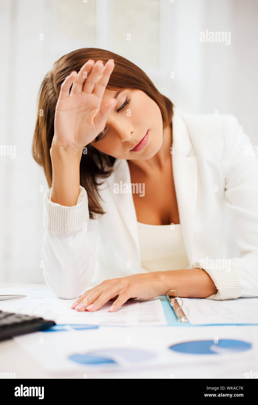 bored and tired woman with documents Stock Photo - Alamy