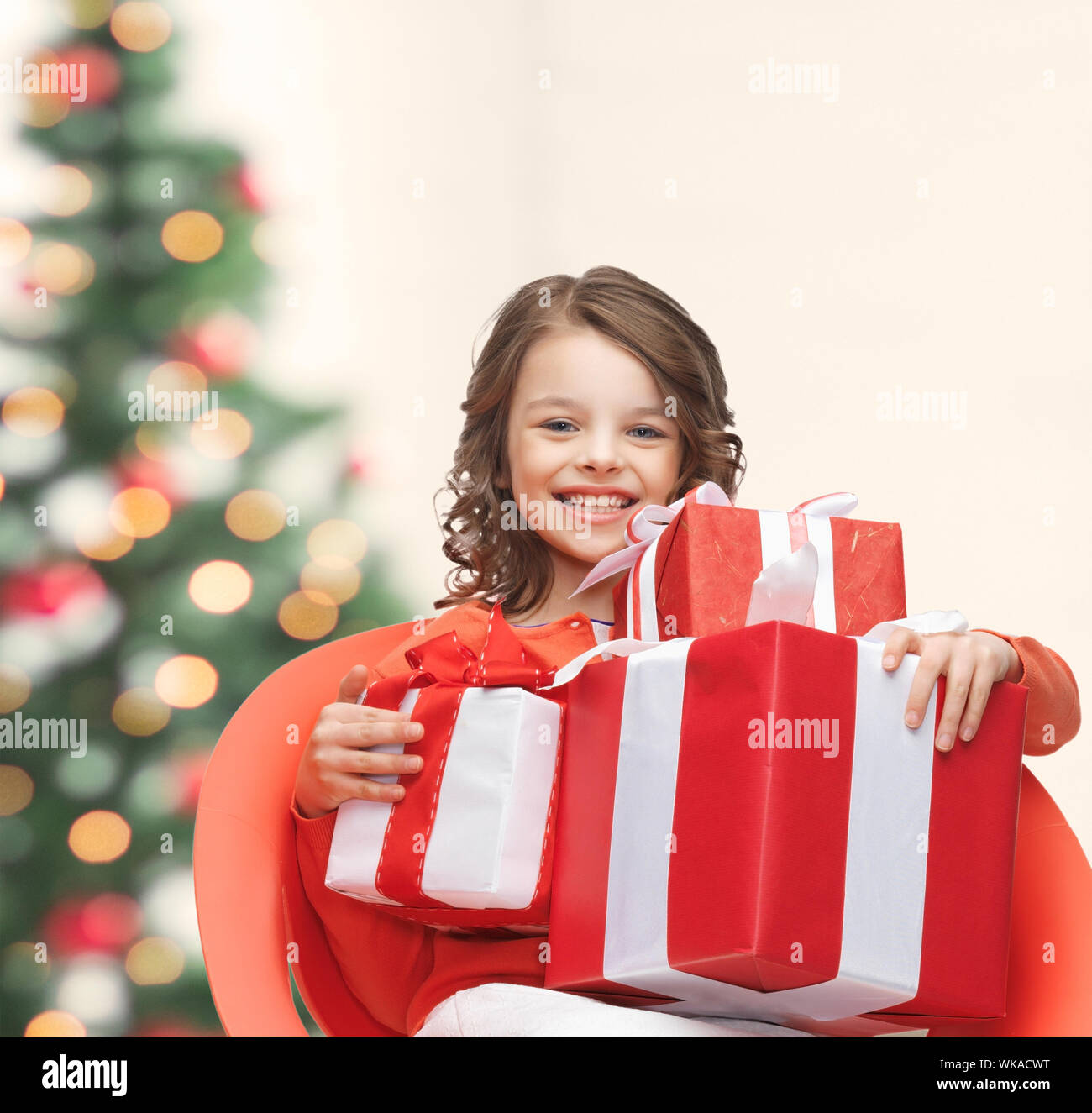 happy child girl with gift boxes Stock Photo - Alamy