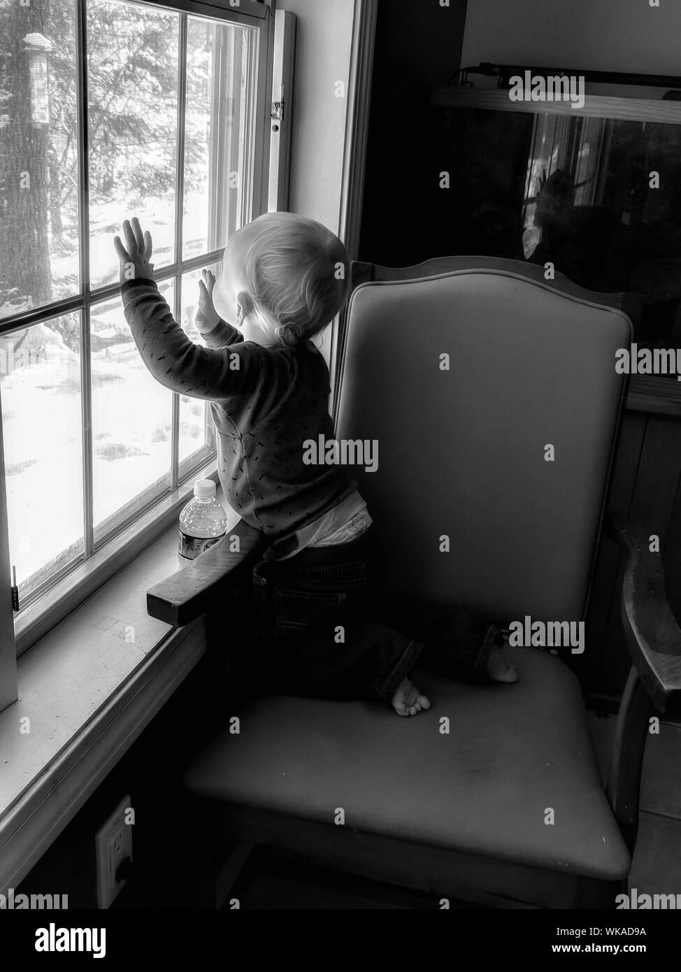 Kneeling on chair hi-res stock photography and images - Alamy