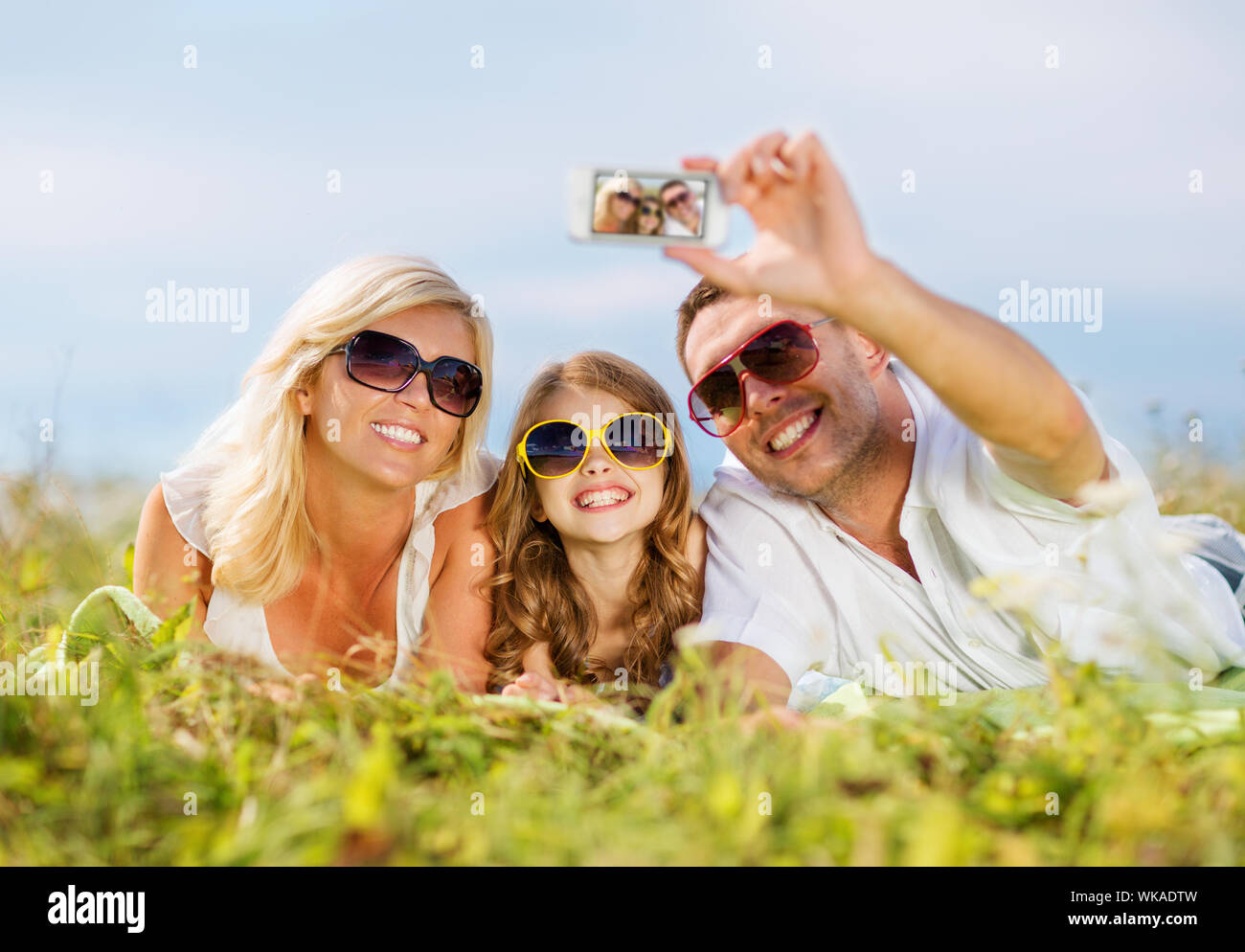 happy family with camera taking picture Stock Photo - Alamy