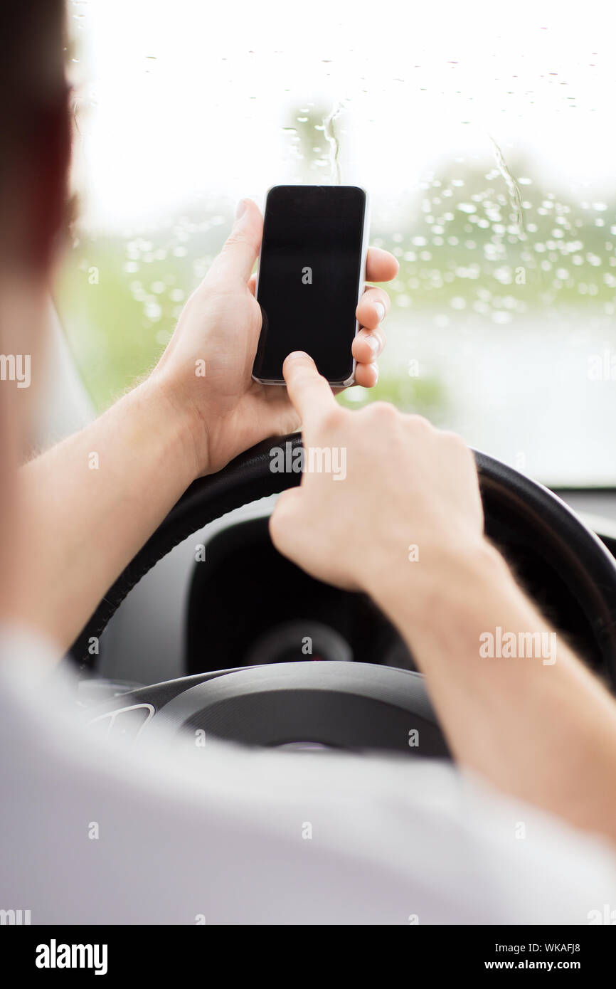 man using phone while driving the car Stock Photo - Alamy