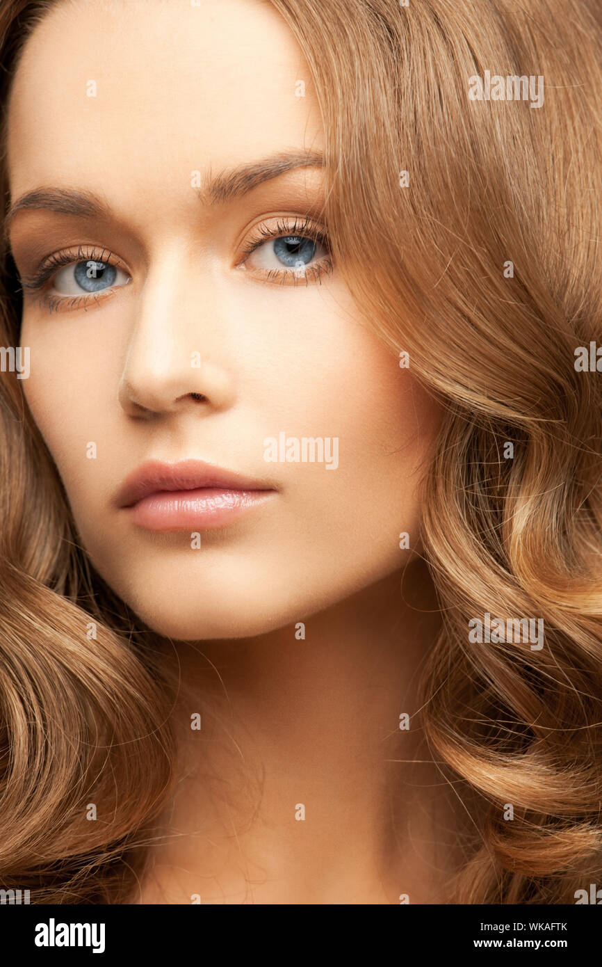 health and beauty concept - face of beautiful woman with long hair ...