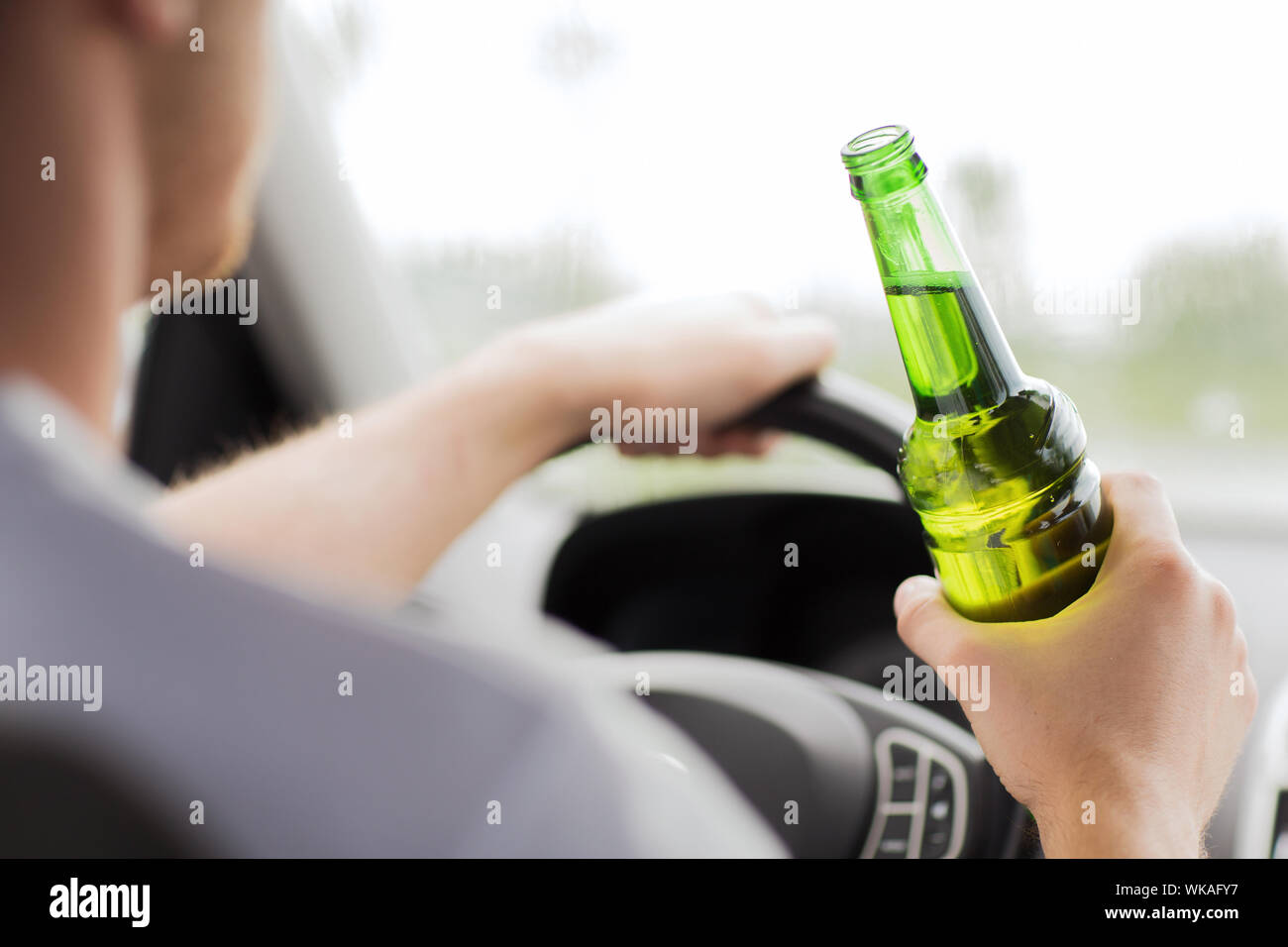 man drinking alcohol while driving the car Stock Photo - Alamy