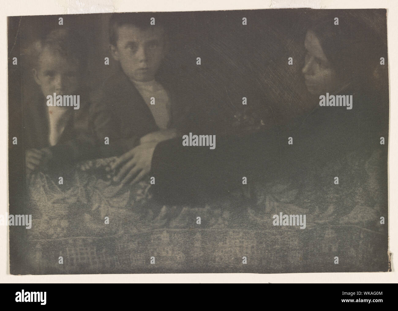 Jane White with sons Lewis and Maynard White on a divan Stock Photo - Alamy