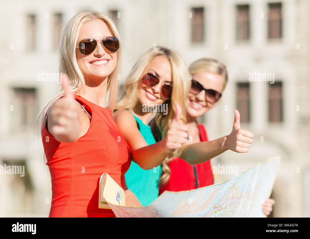beautiful women with tourist map in the city Stock Photo - Alamy